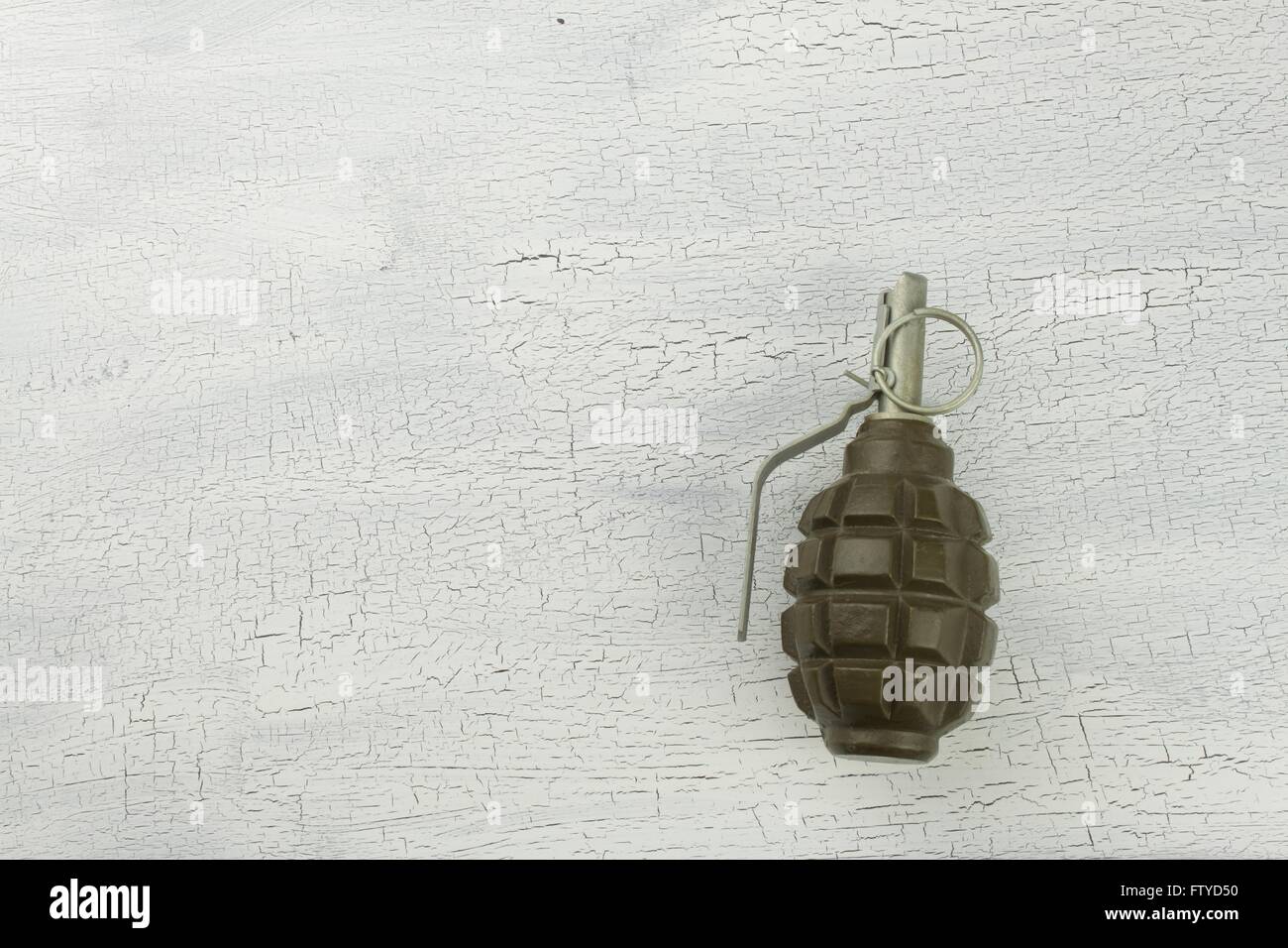 Hand grenade on shadowed, cracked background. War game. Sales of ...