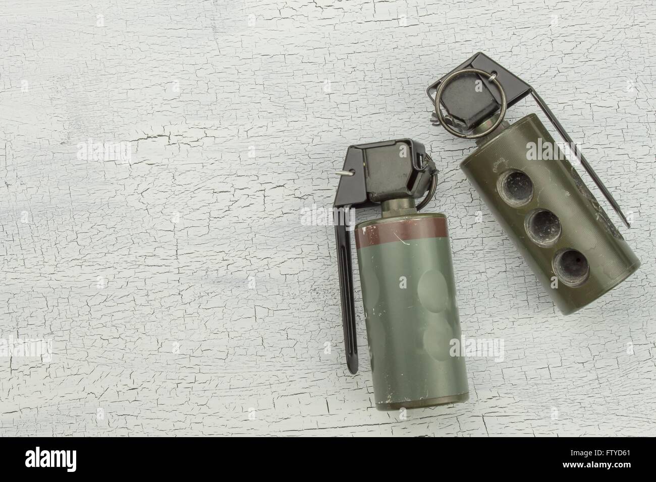Hand grenade on shadowed, cracked background. War game. Sales of ...