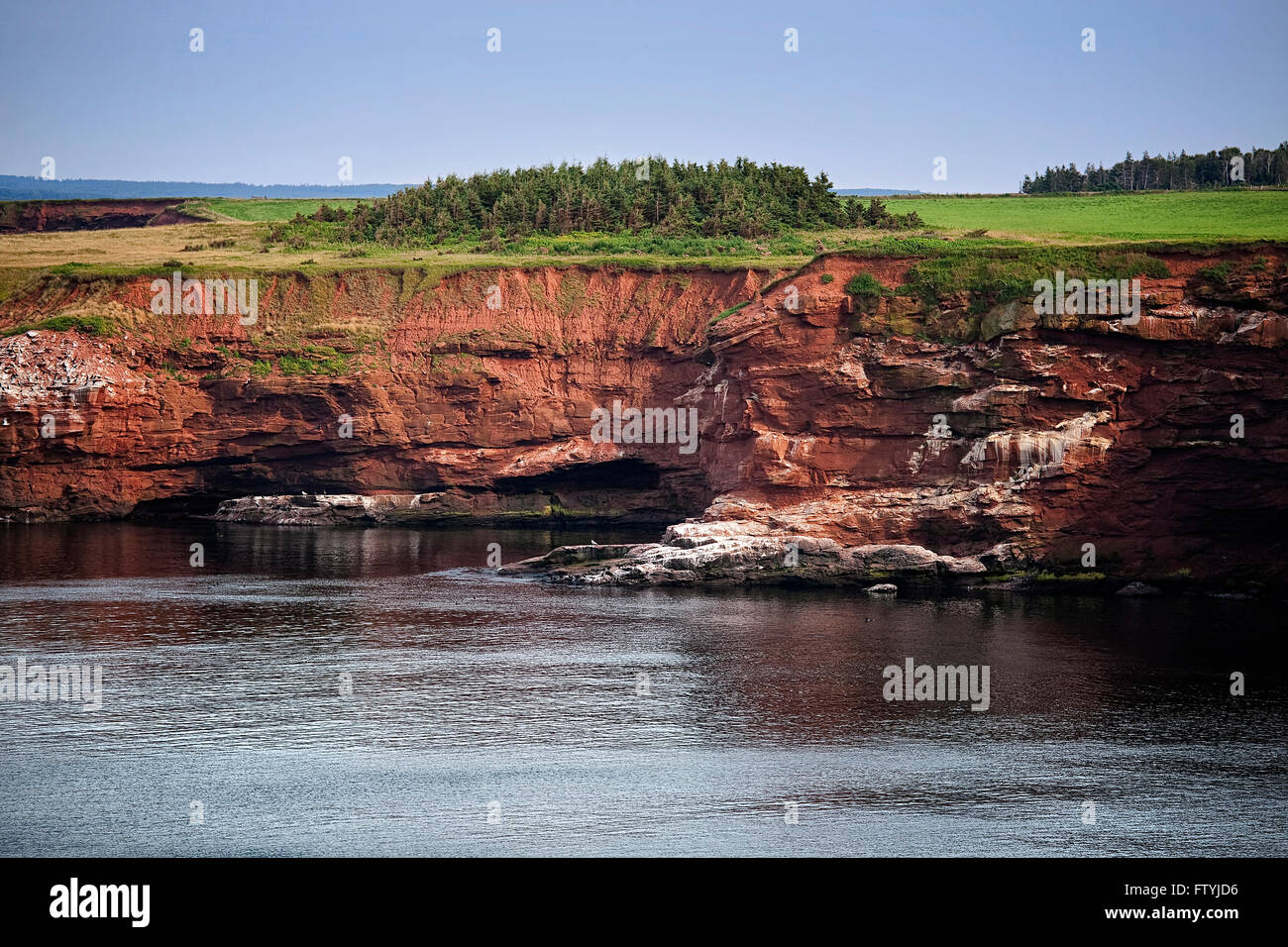 High sandstone cliffs on the north side of Prince Edward Island, Canada ...
