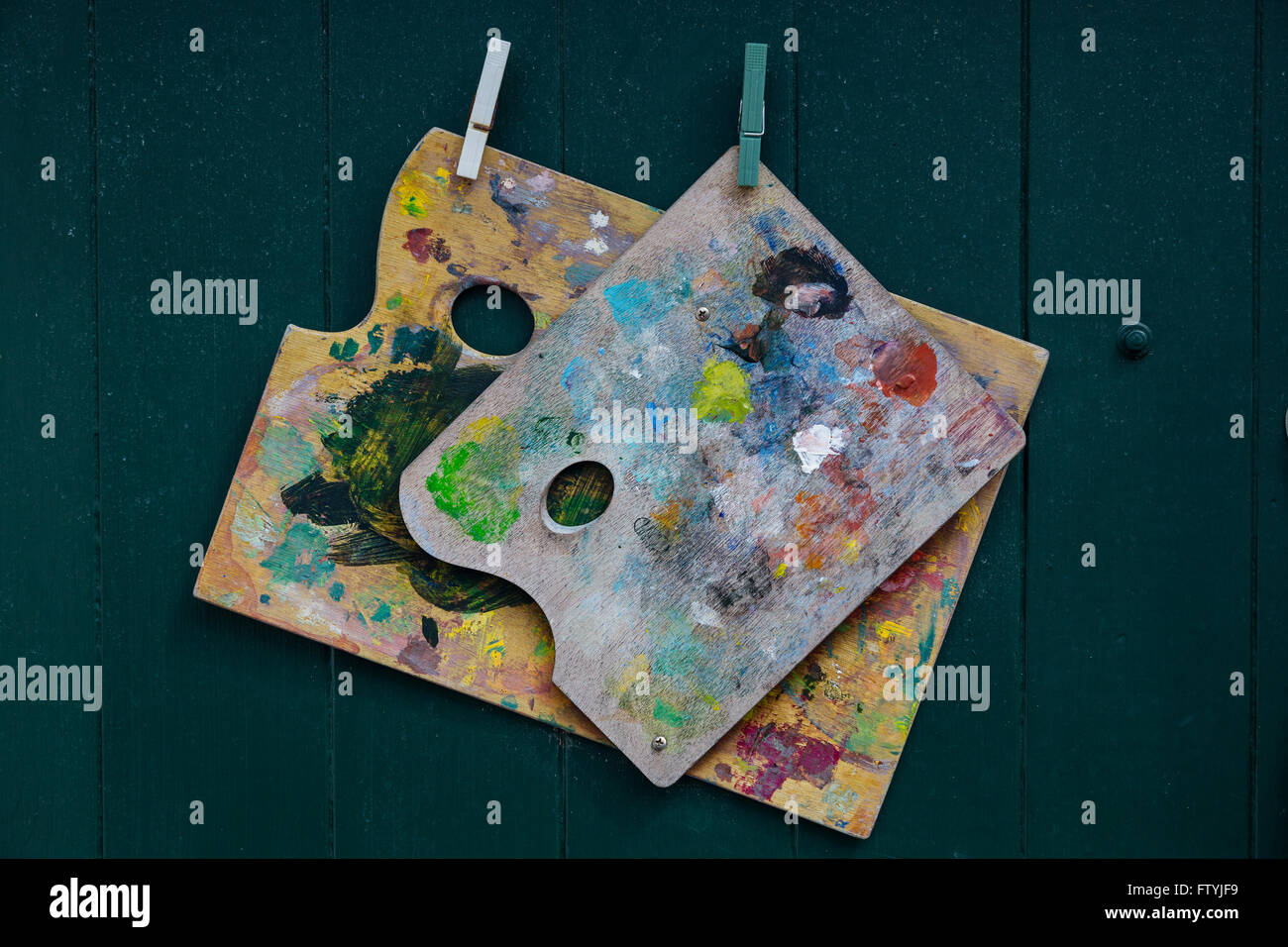 Artist palettes smeared with paint Stock Photo - Alamy