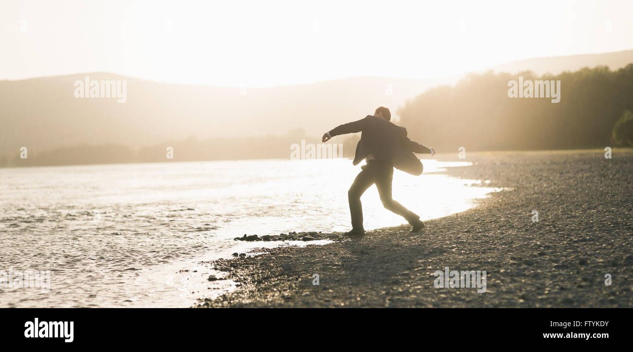 Throwing pebbles into sea hi-res stock photography and images - Alamy
