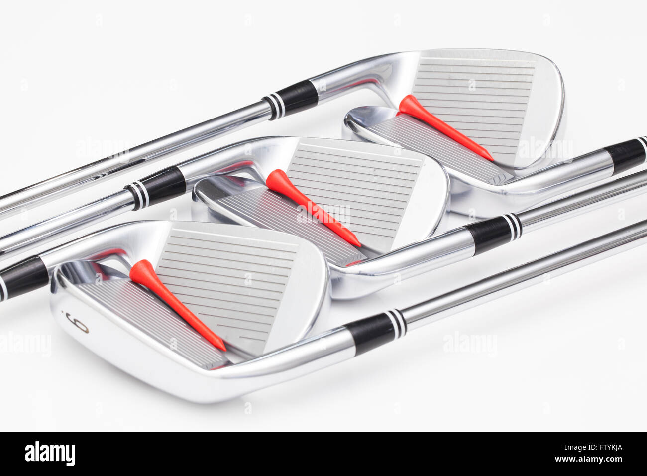 Titanium golf clubs on the white background Stock Photo - Alamy