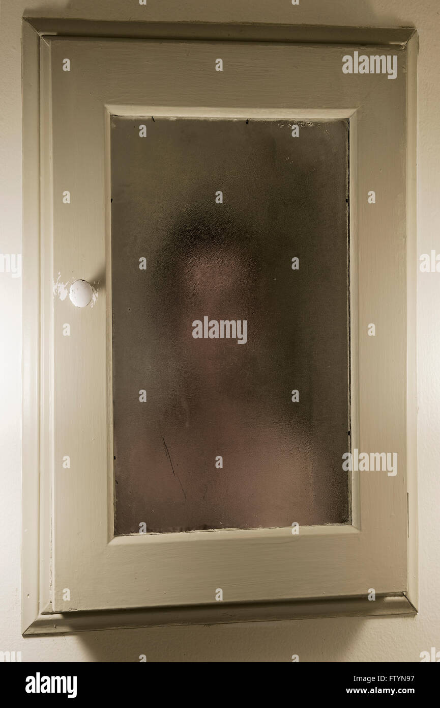 Man confronts his murky image in the mirror Stock Photo - Alamy