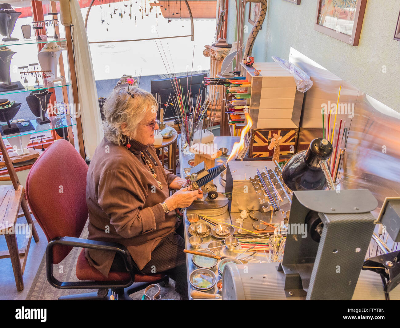 Kate Drew-Wilkinson, a well known art glass artist, works in her studio ...