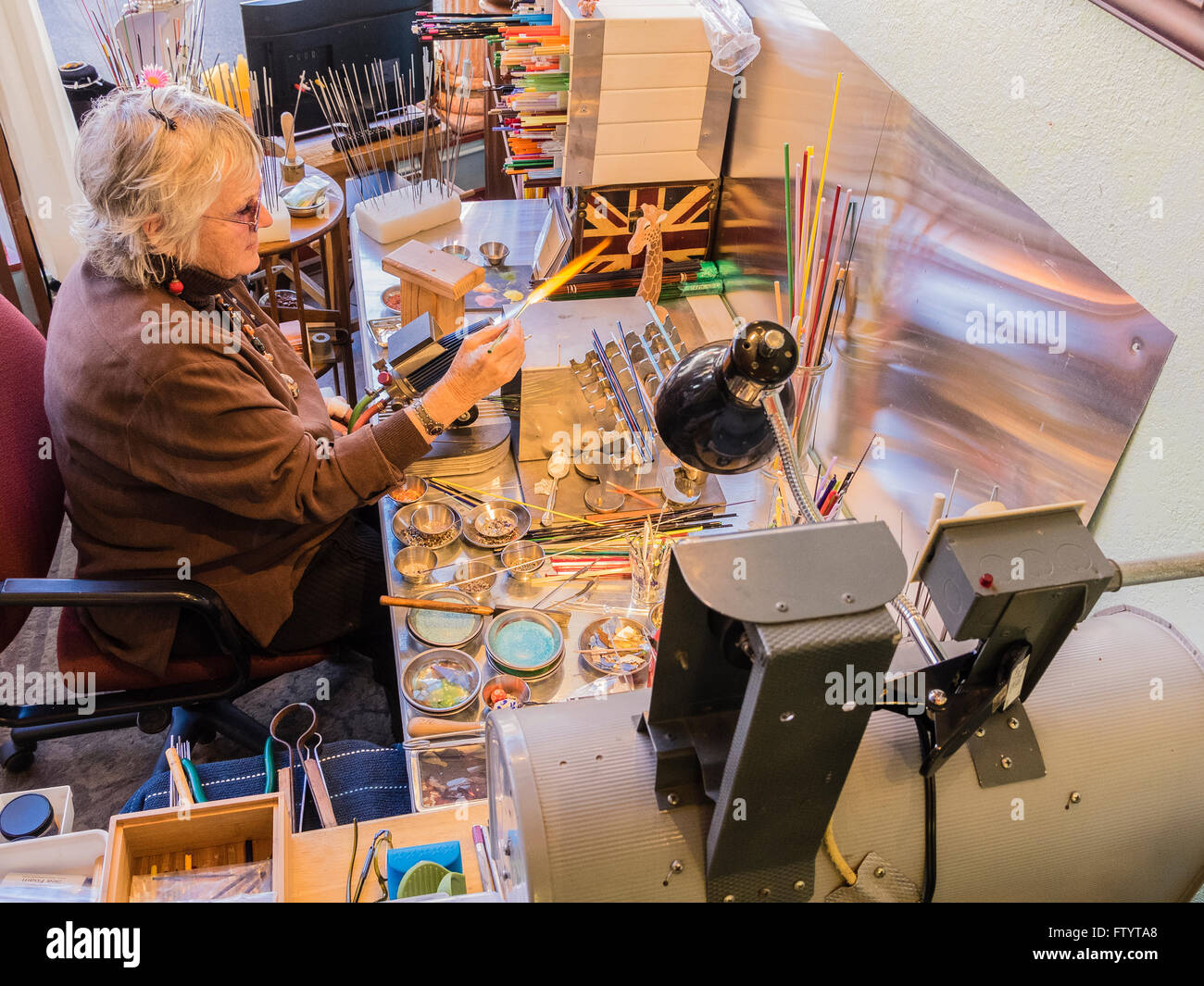 Kate Drew-Wilkinson, a well known art glass artist, works in her studio ...
