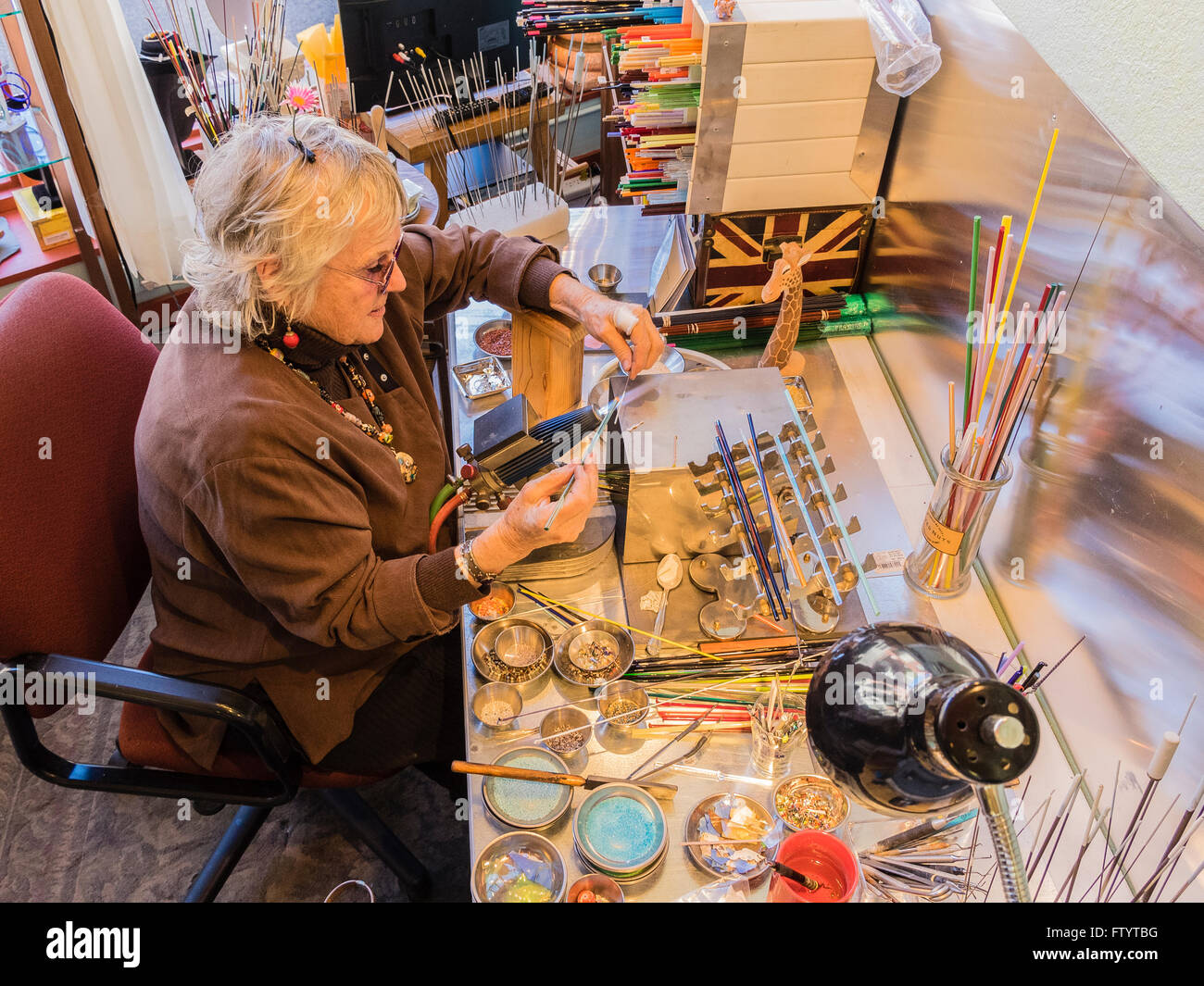Kate Drew-Wilkinson, a well known art glass artist, works in her studio ...