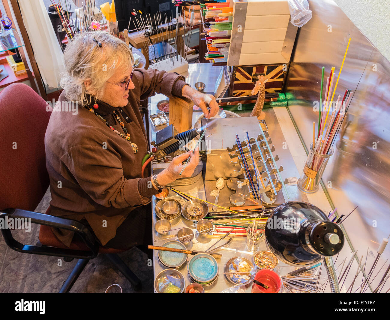 Kate Drew-Wilkinson, a well known art glass artist, works in her studio ...