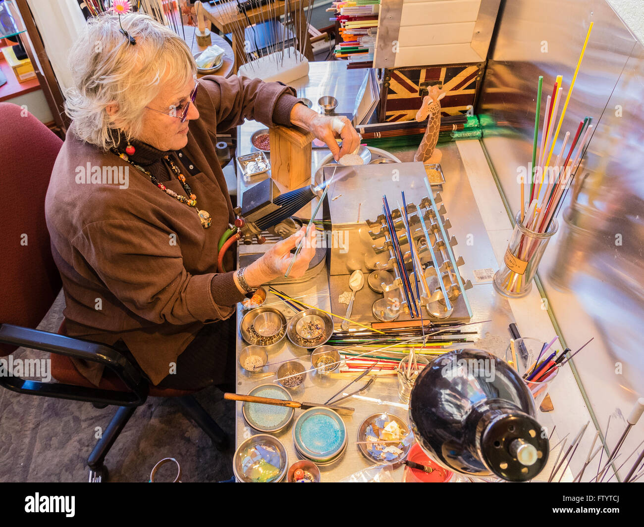 Kate Drew-Wilkinson, a well known art glass artist, works in her studio ...