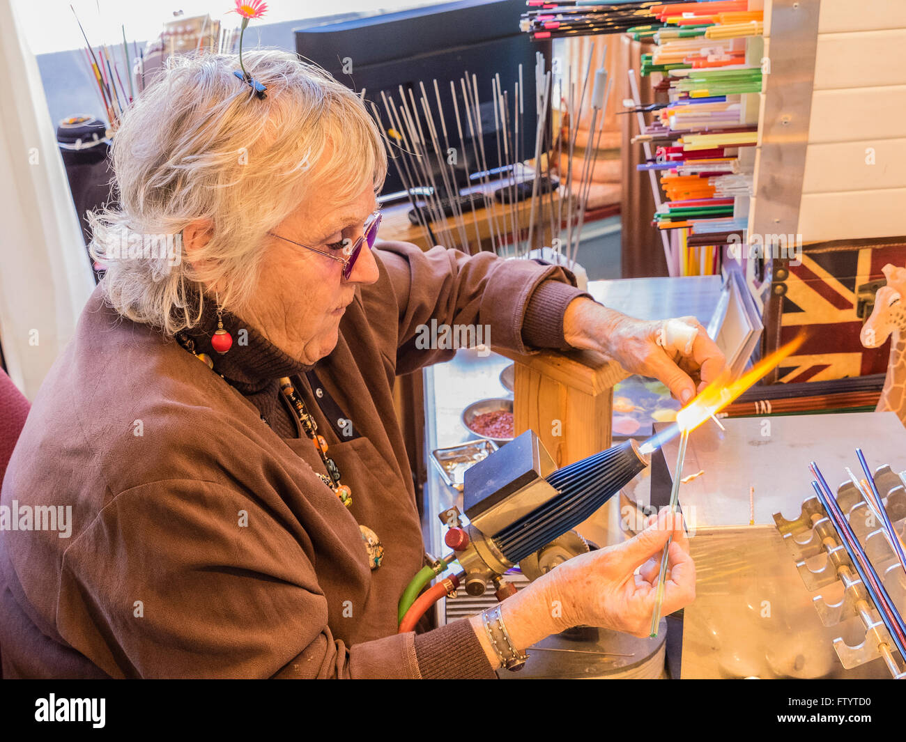 Kate Drew-Wilkinson, a well known art glass artist, works in her studio ...