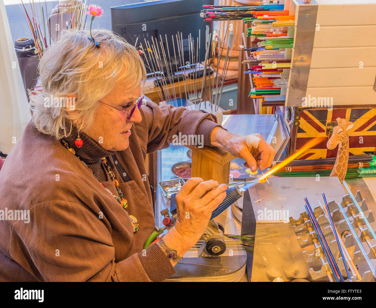 Kate Drew-Wilkinson, a well known art glass artist, works in her studio ...