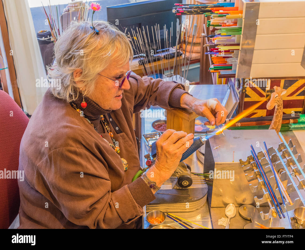 Kate Drew-Wilkinson, a well known art glass artist, works in her studio ...