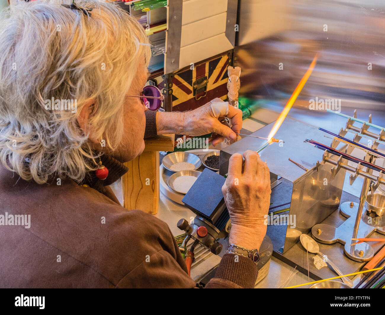 Kate Drew-Wilkinson, a well known art glass artist, works in her studio ...