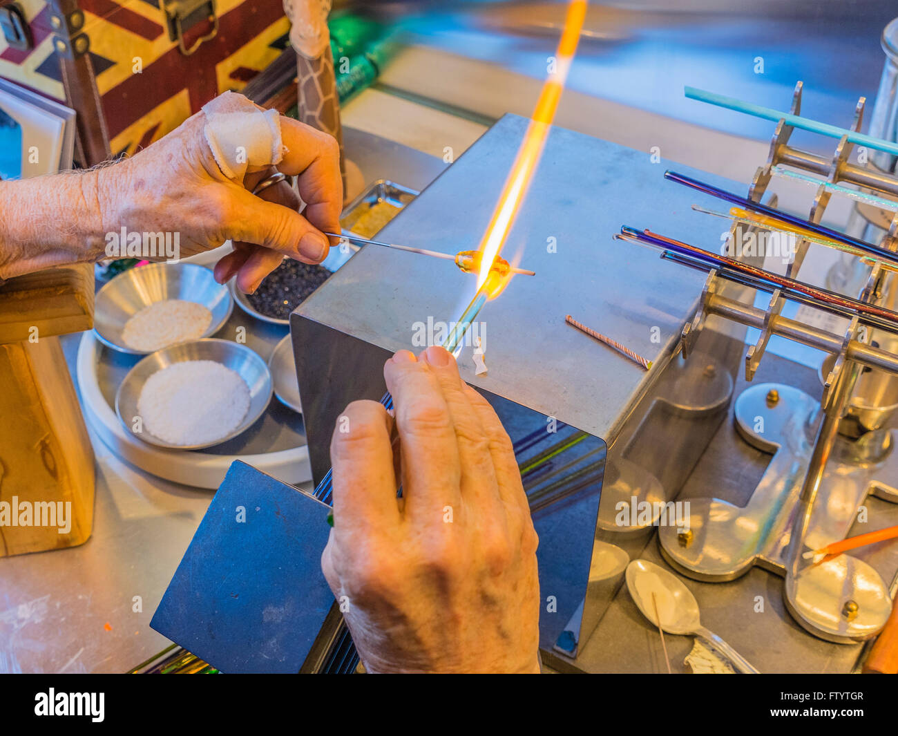 Kate Drew-Wilkinson, a well known art glass artist, works in her studio ...