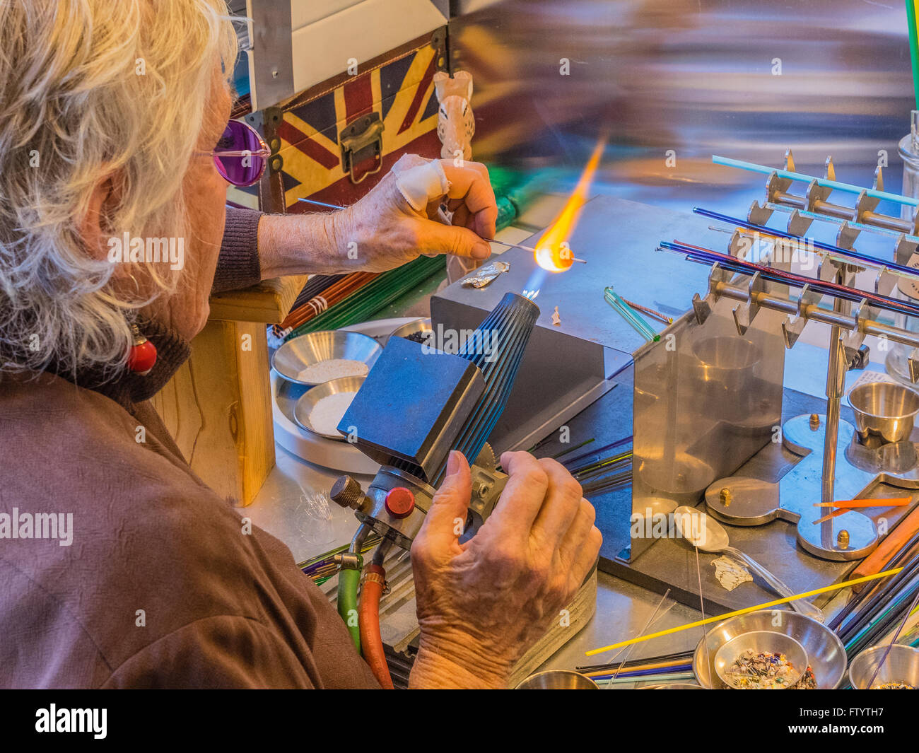 Kate Drew-Wilkinson, a well known art glass artist, works in her studio ...