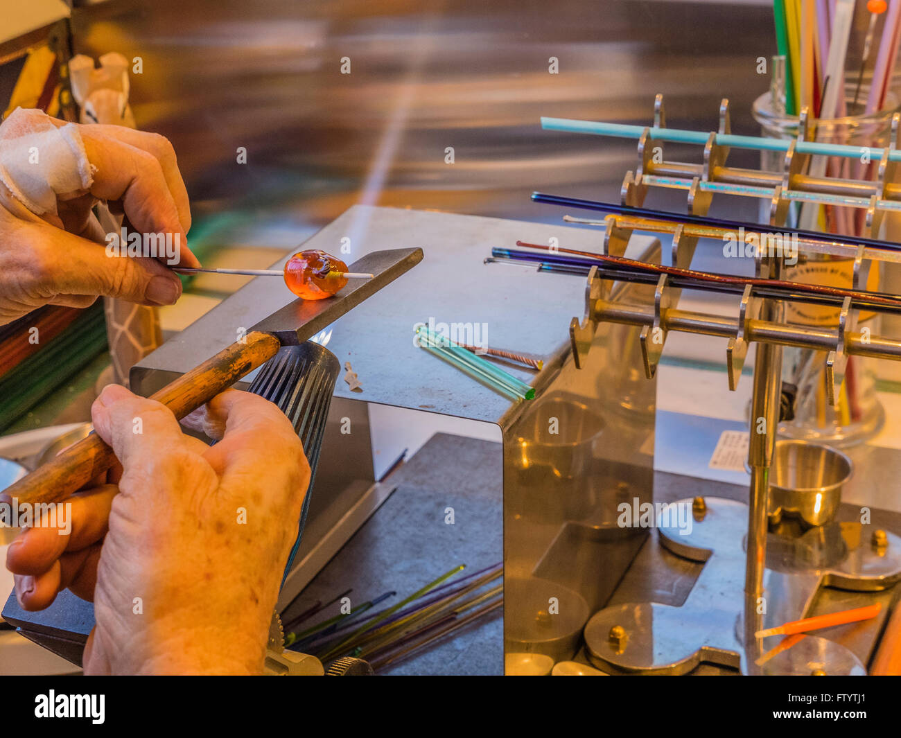 Kate Drew-Wilkinson, a well known art glass artist, works in her studio ...