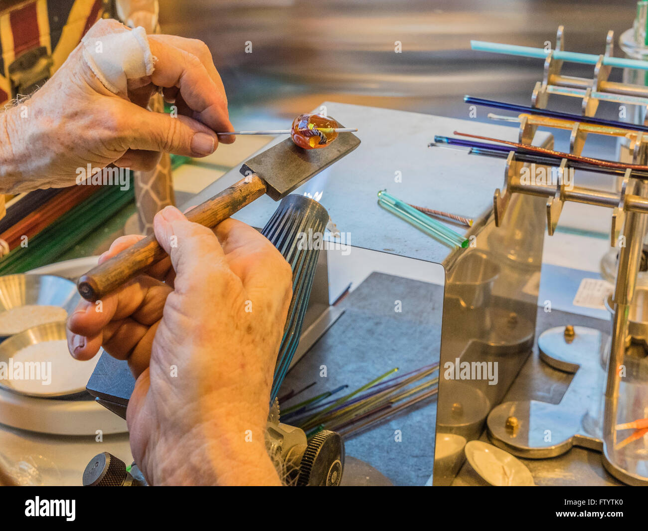 Kate Drew-Wilkinson, a well known art glass artist, works in her studio ...