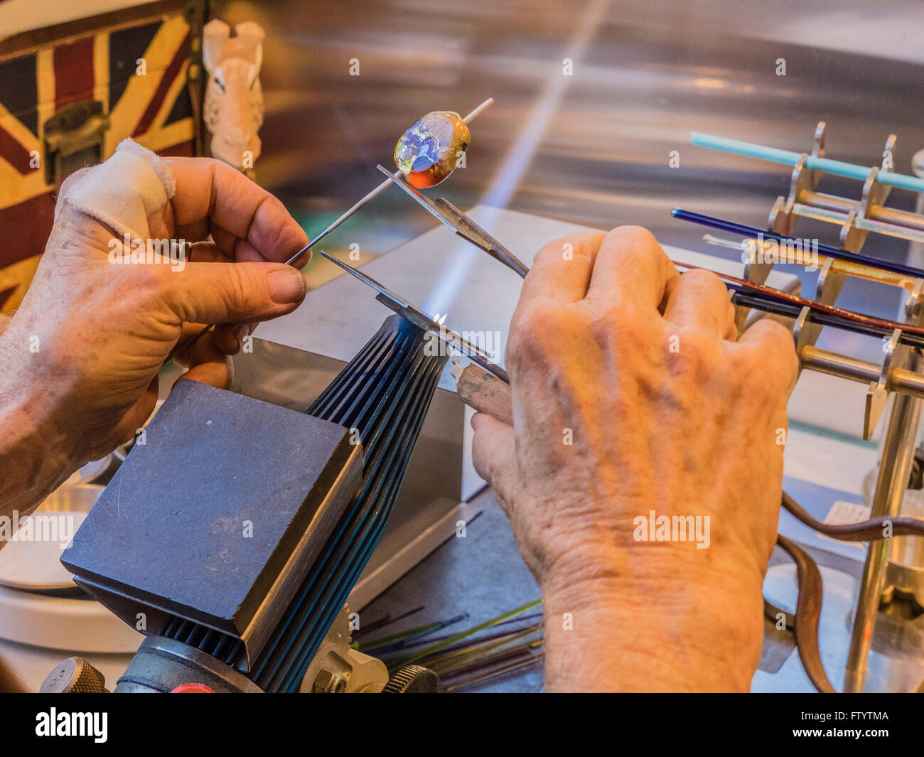 Kate Drew-Wilkinson, a well known art glass artist, works in her studio ...