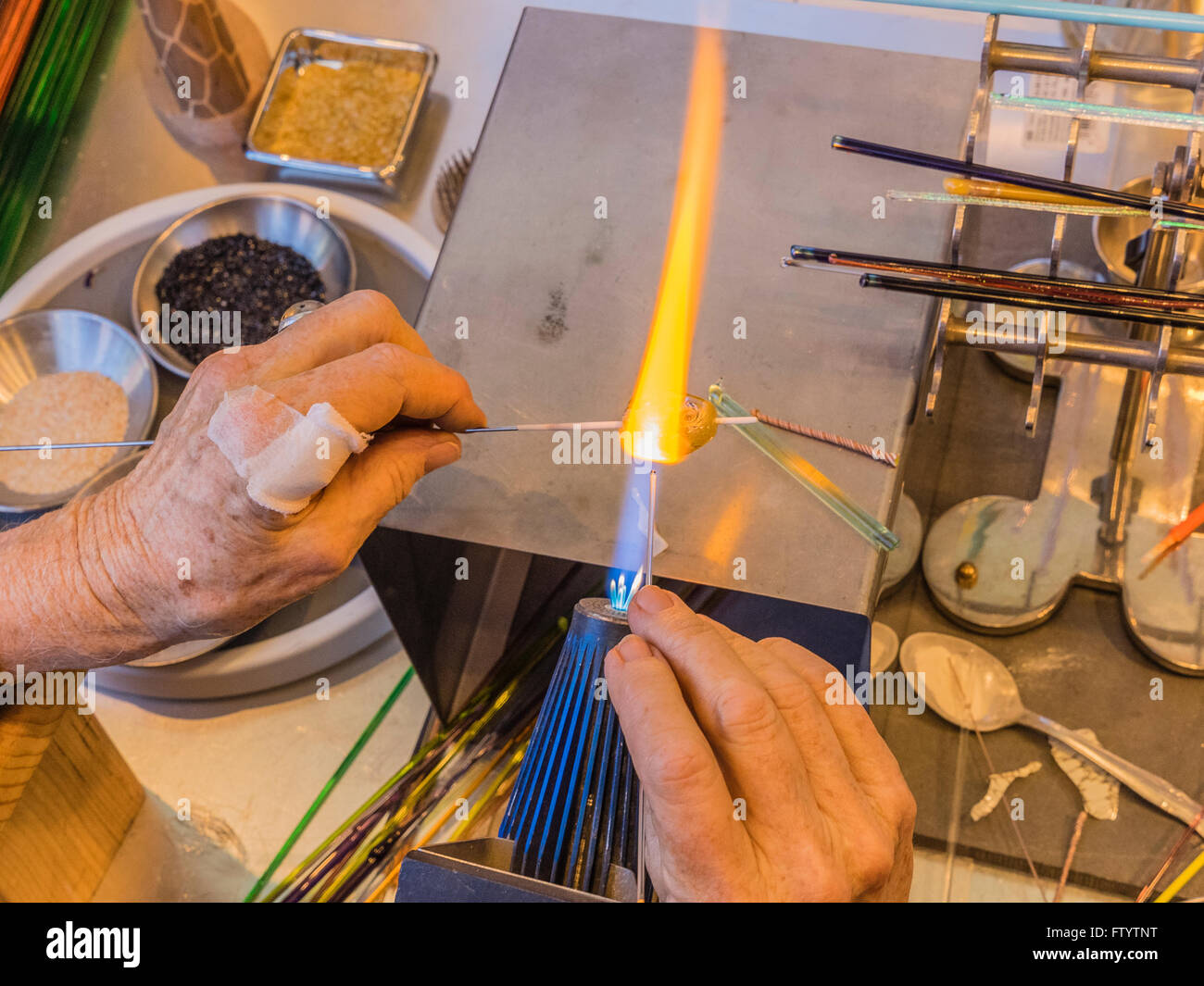 Kate Drew-Wilkinson, a well known art glass artist, works in her studio ...
