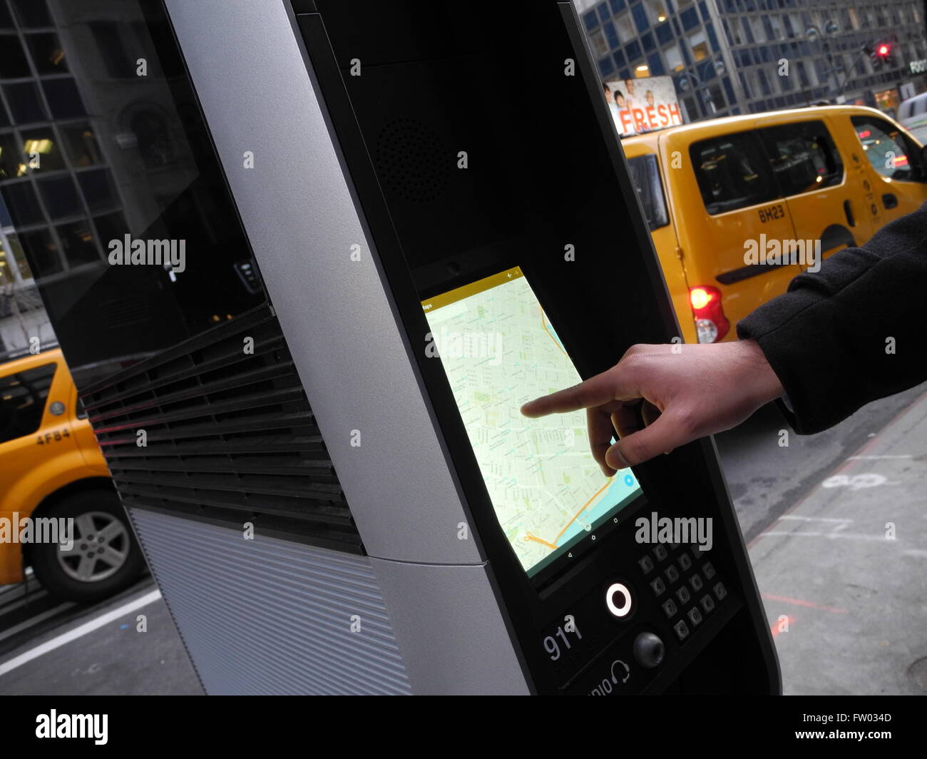 New York, USA. 23rd Mar, 2016. A man uses a LinkNYC station in New York ...