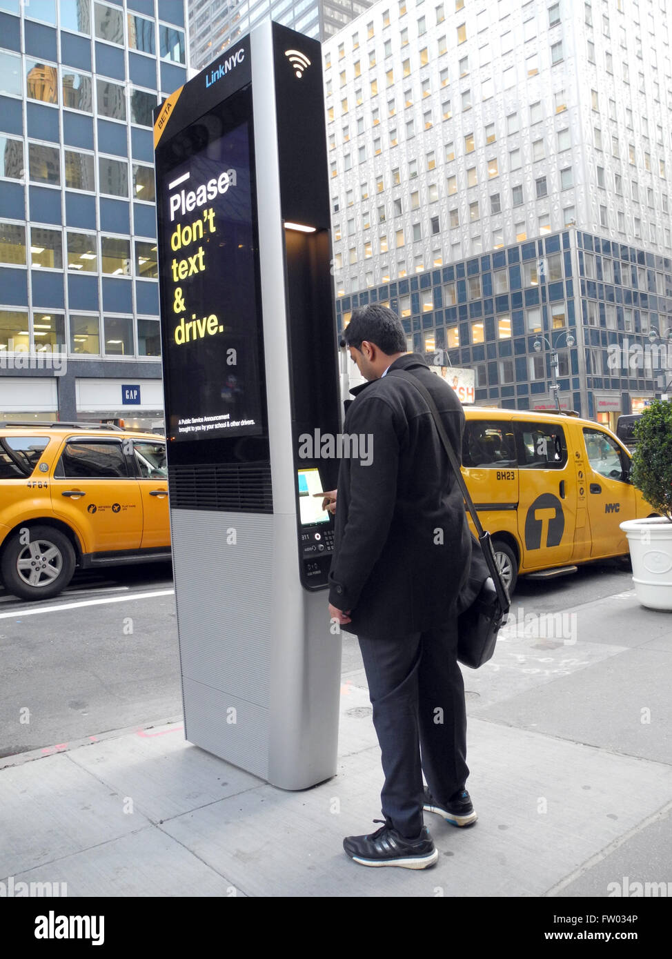 New York, USA. 23rd Mar, 2016. A man uses a LinkNYC station in New York ...