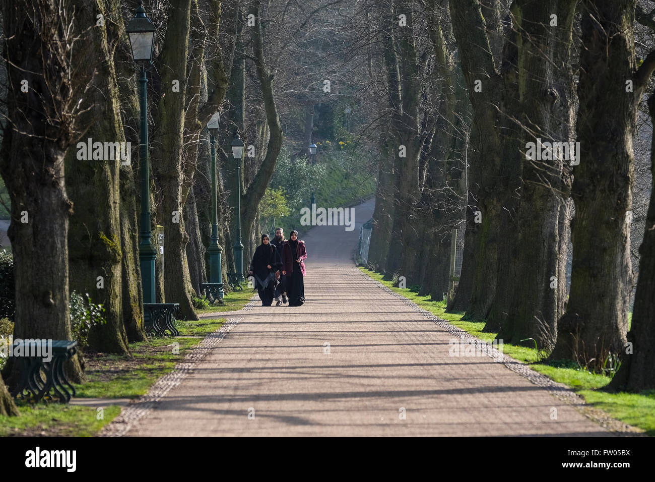 Group of Muslim women walking along path in Preston's Avenham Park ...