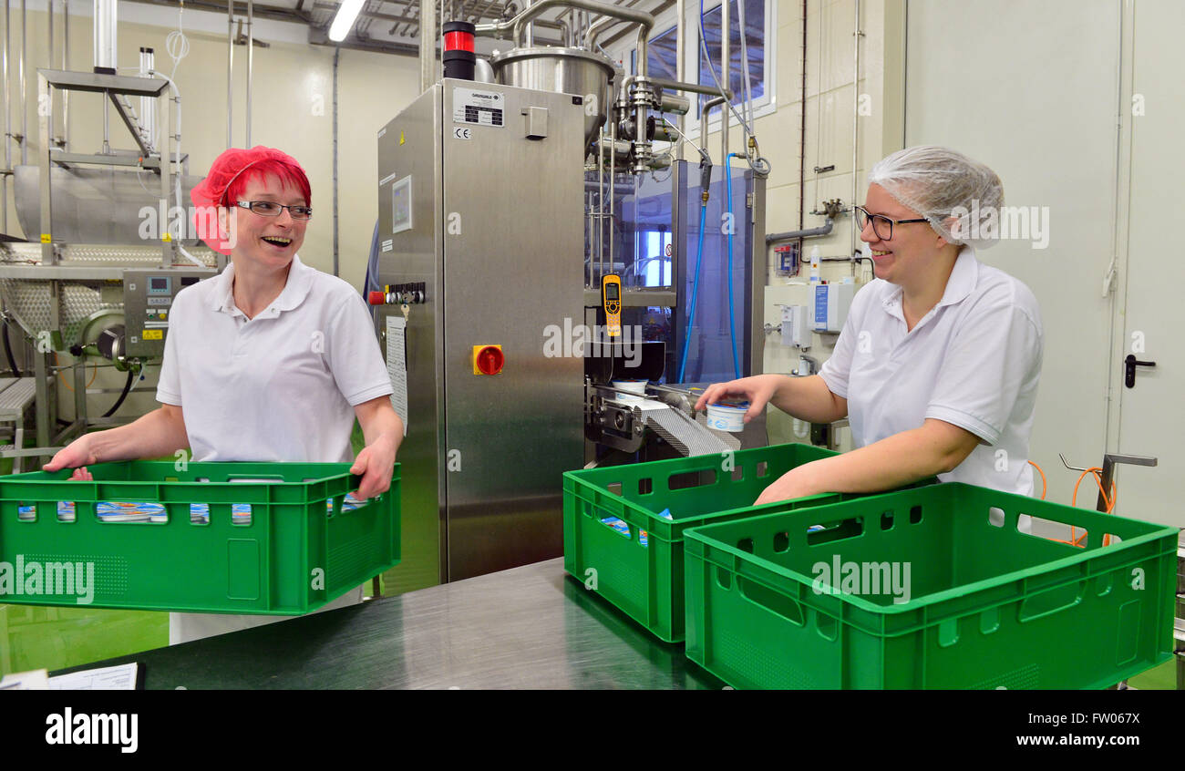 Marina Peter (r-l) and Annett Eckert bottle yoghurt at Dittersdorfer ...