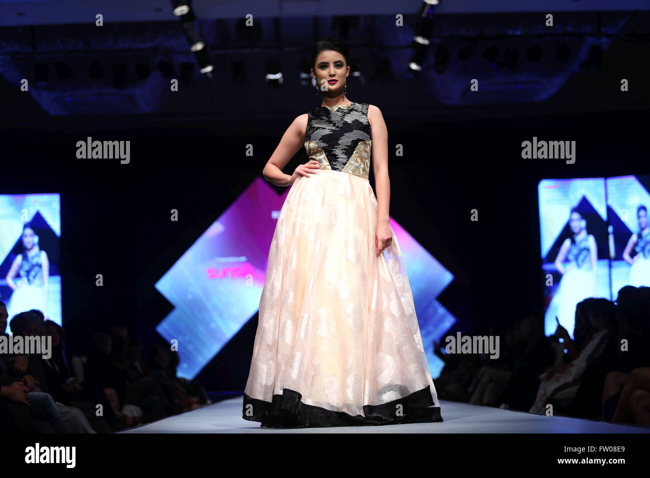 Kathmandu, Nepal. 31st Mar, 2016. A model walks on the ramp wearing a ...