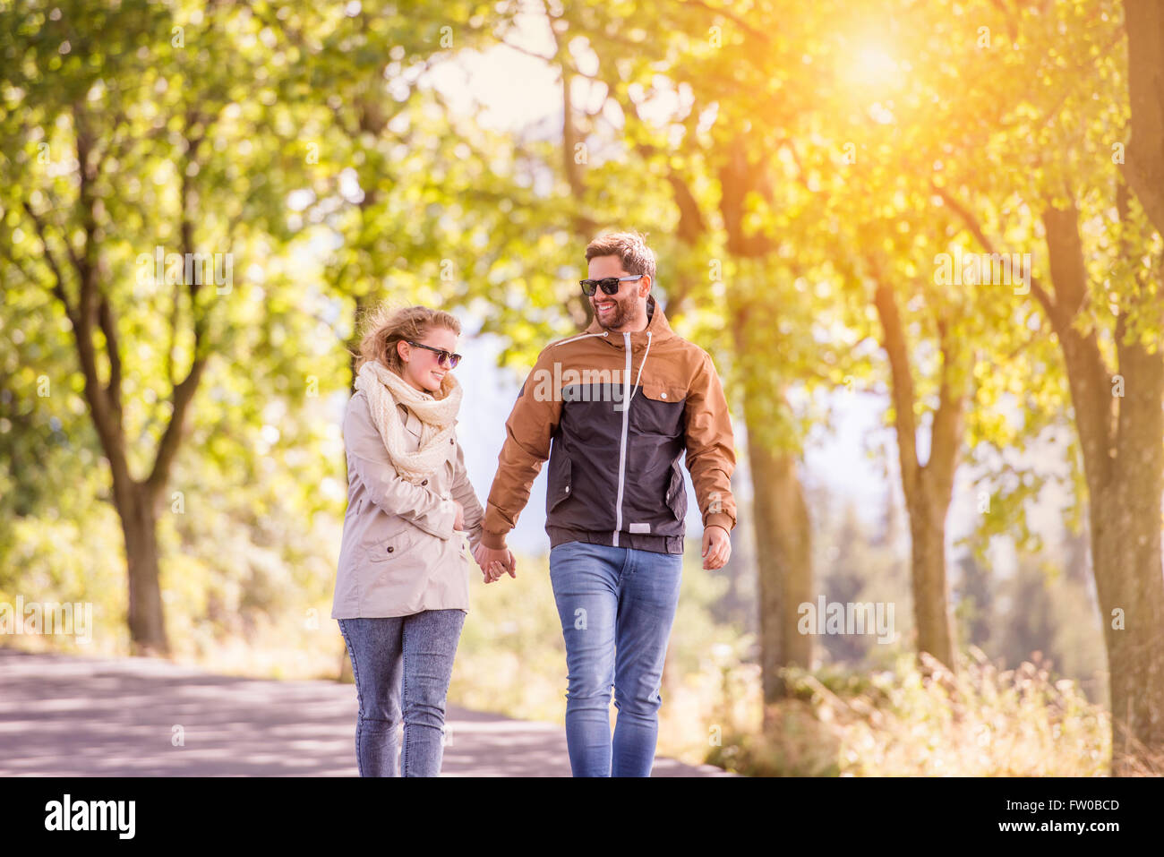 Couple in love in autumn nature on a walk Stock Photo - Alamy