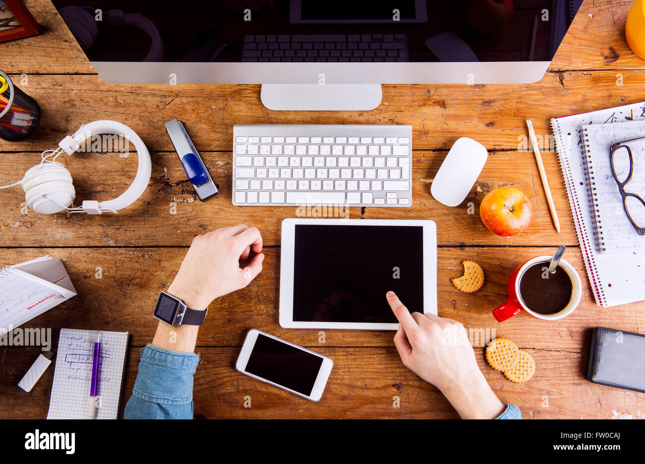 Business person working at office desk wearing smart watch Stock Photo ...