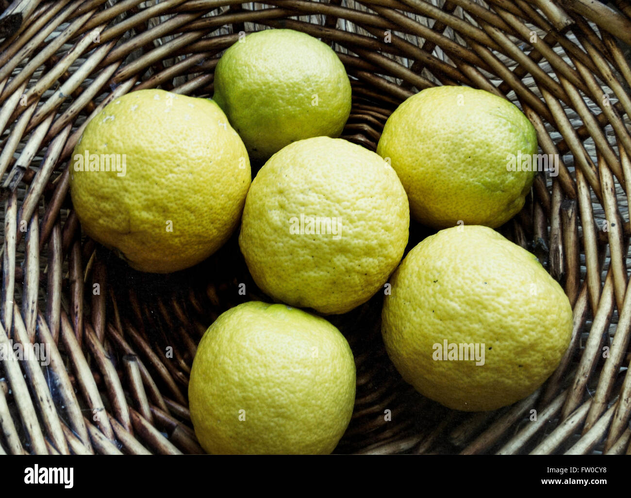 Lemons in a Wicker Basket Stock Photo - Alamy