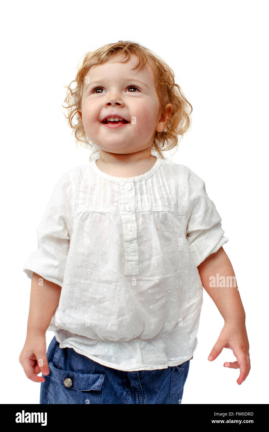 Young baby standing indoors applauding and smiling Stock Photo - Alamy