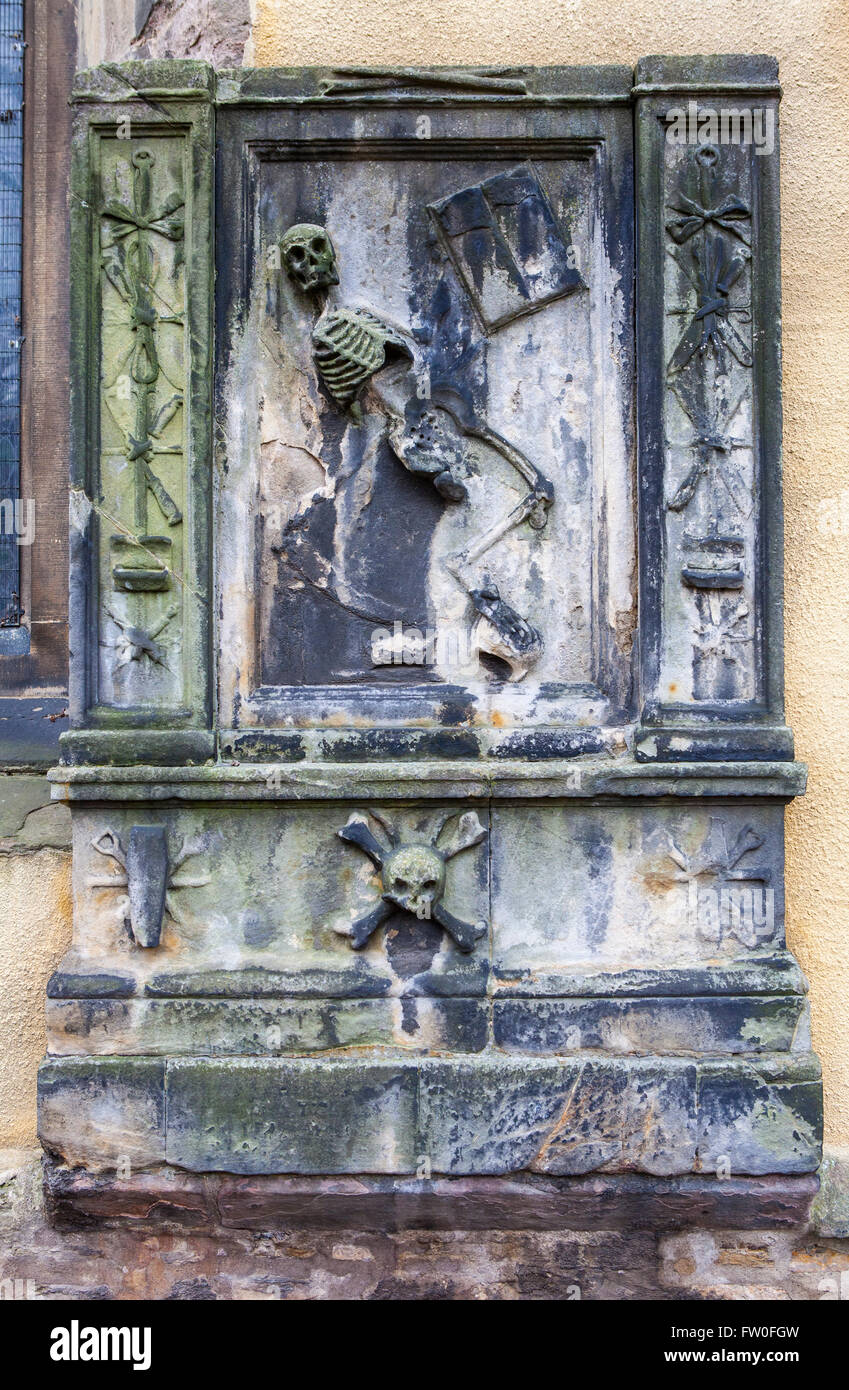 EDINBURGH, SCOTLAND - MARCH 11TH 2016: A dancing skeleton carrying a ...