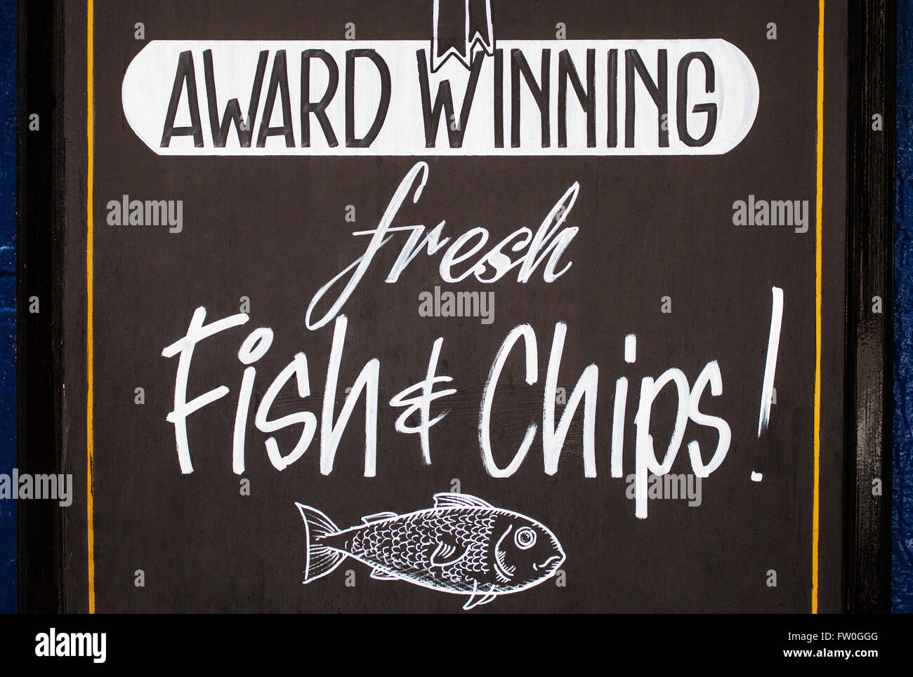 A board outside a vintage pub advertising fresh Fish and Chips - a ...