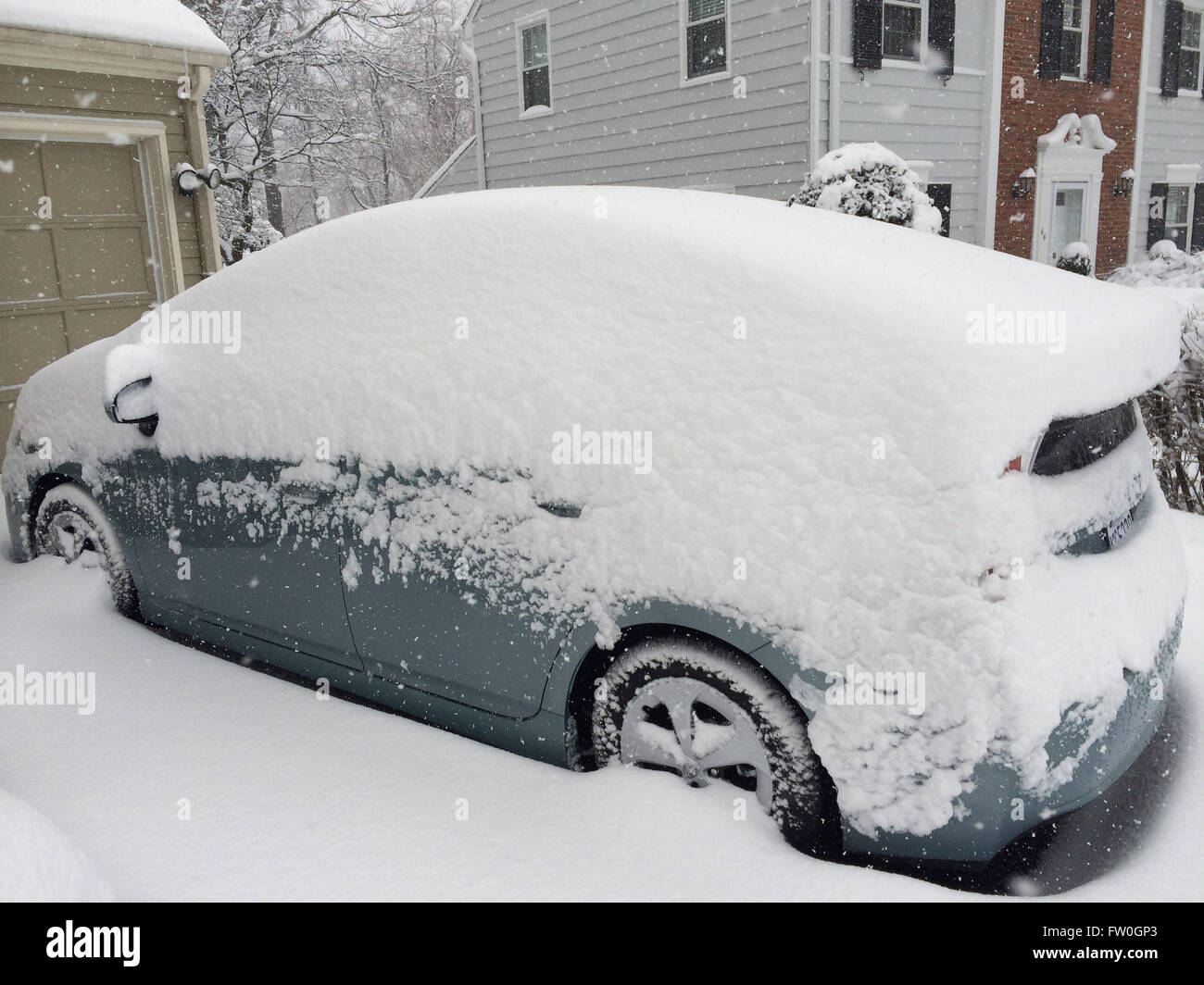 suburban car covered from snowstorm Stock Photo - Alamy