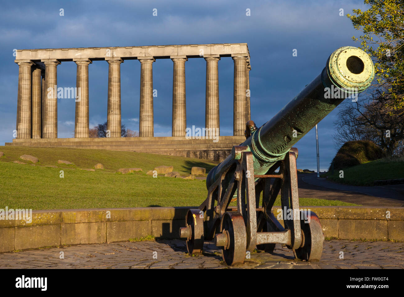 A view of the National Monument of Scotland and a Cannon, situated on ...
