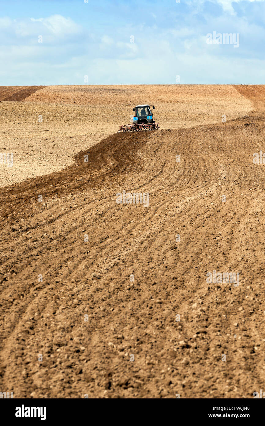 tractor plowing field Stock Photo - Alamy