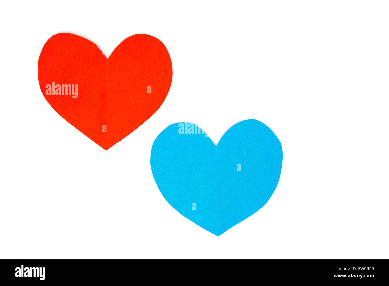 Cut red and blue paper hearts together isolated on white background ...