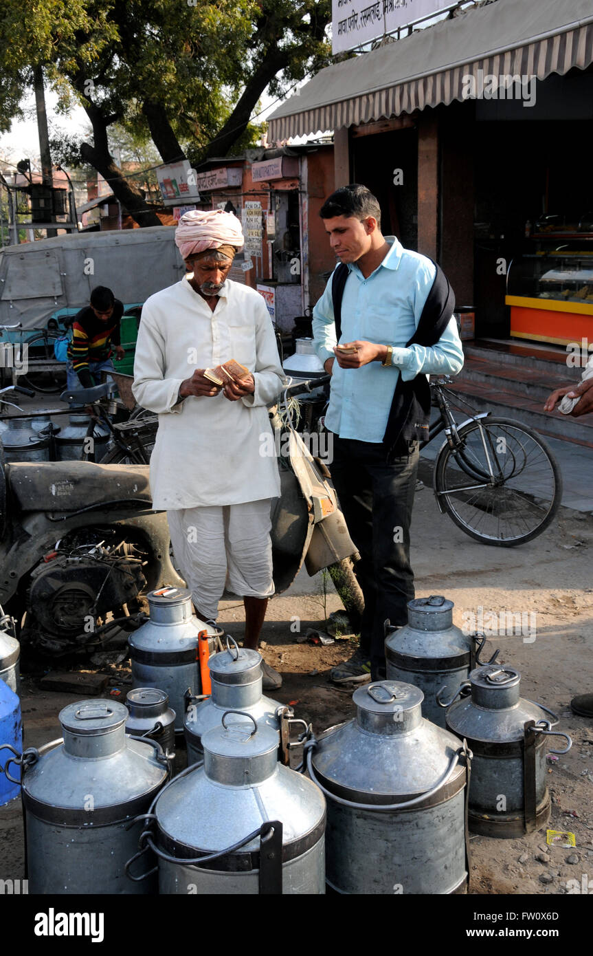 A Turbaned Farmer Selling His Milk At The Milk Market In Jaipur