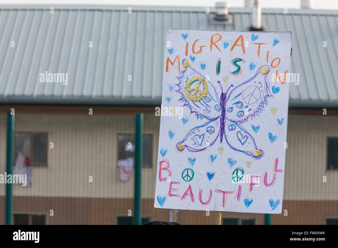Milton Ernest, UK. 12th March, 2016. A 'Migration Is Beautiful' sign ...