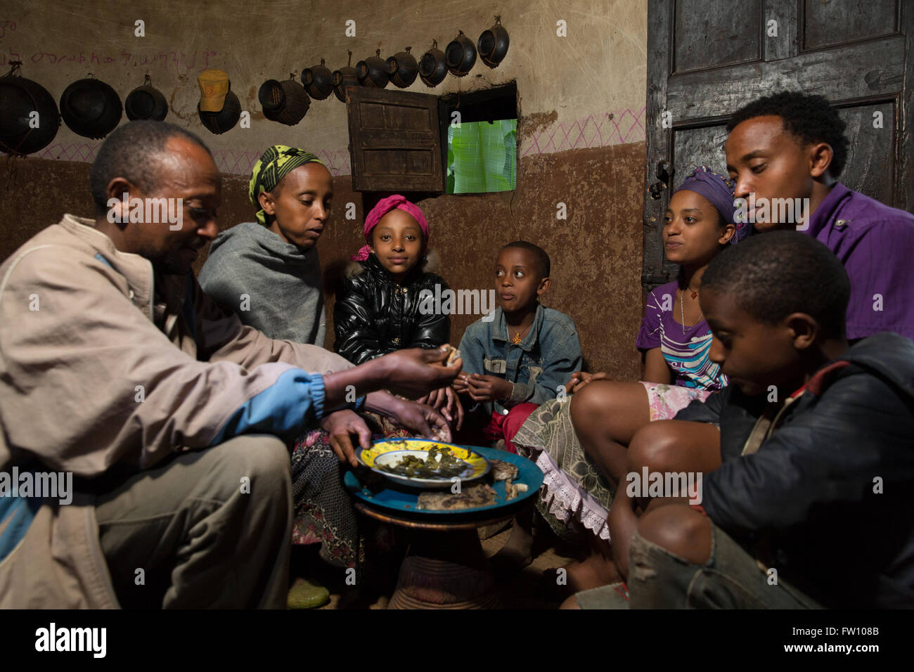 Gurage, Ethiopia, October 2013 Tedela Asfew and his family having a ...