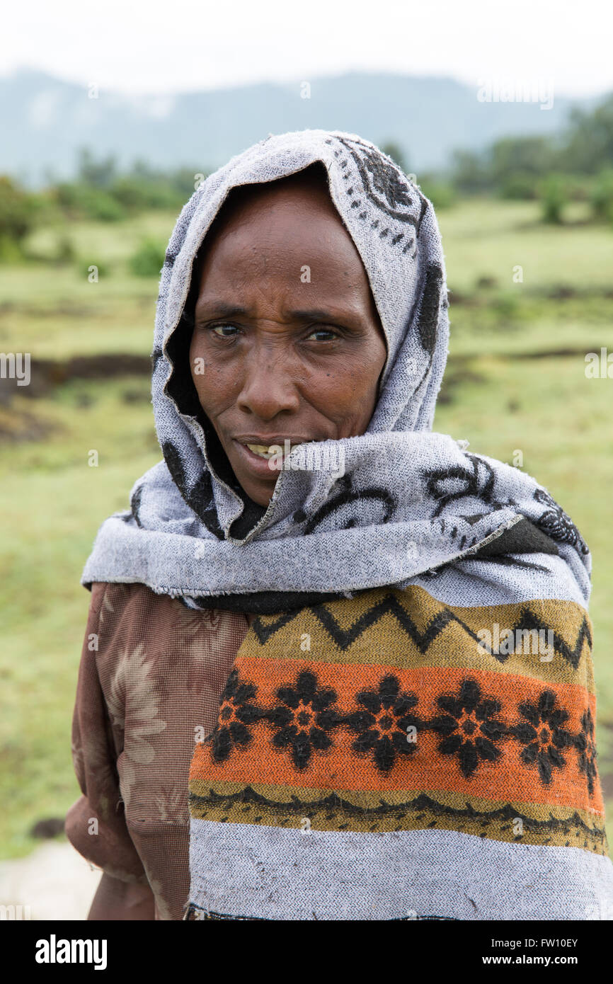 Hulager Tufer, 55, washing sacks in a puddle after heavy rain. She will ...