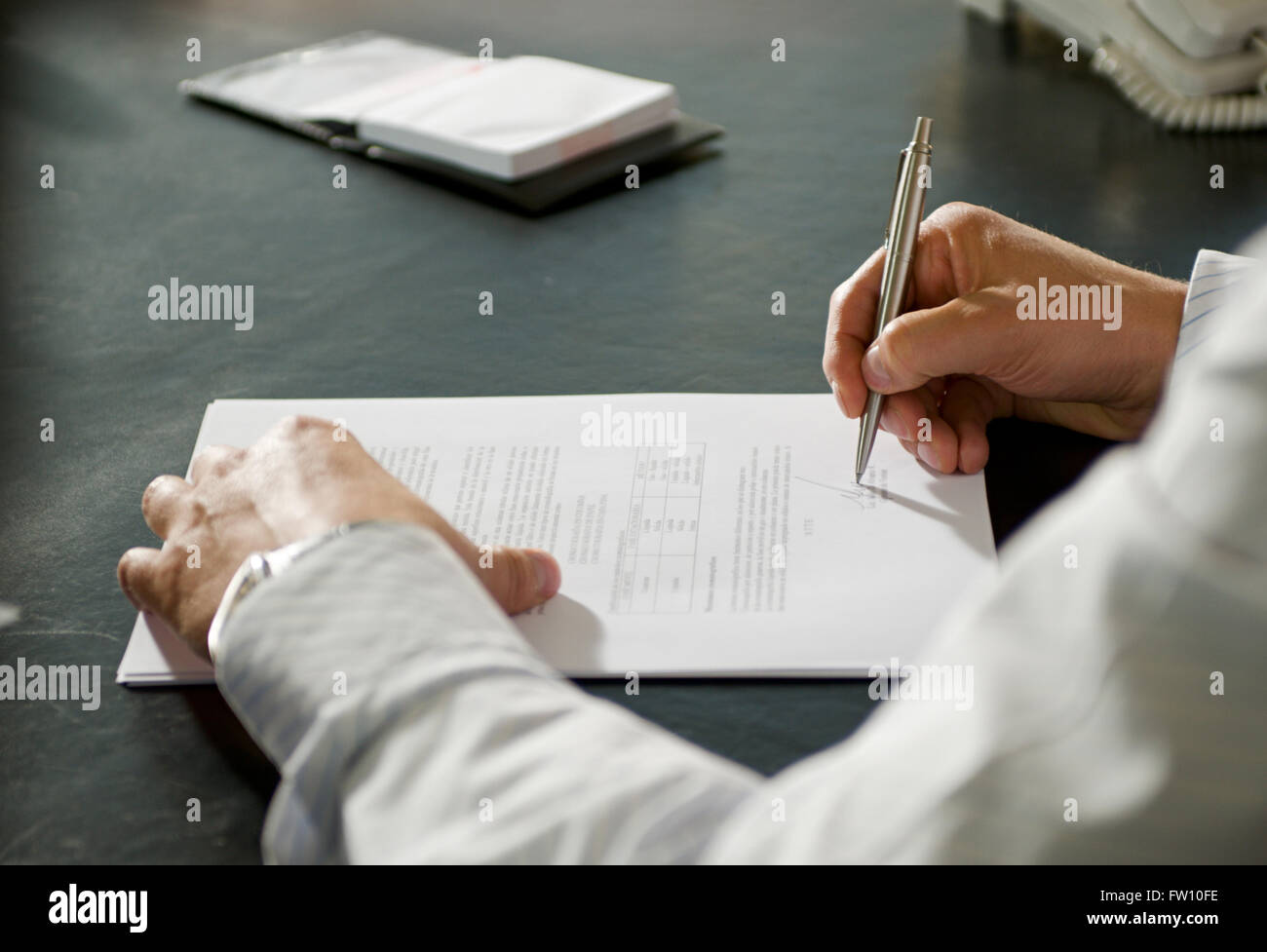 businessman hands signing on a desk Stock Photo - Alamy