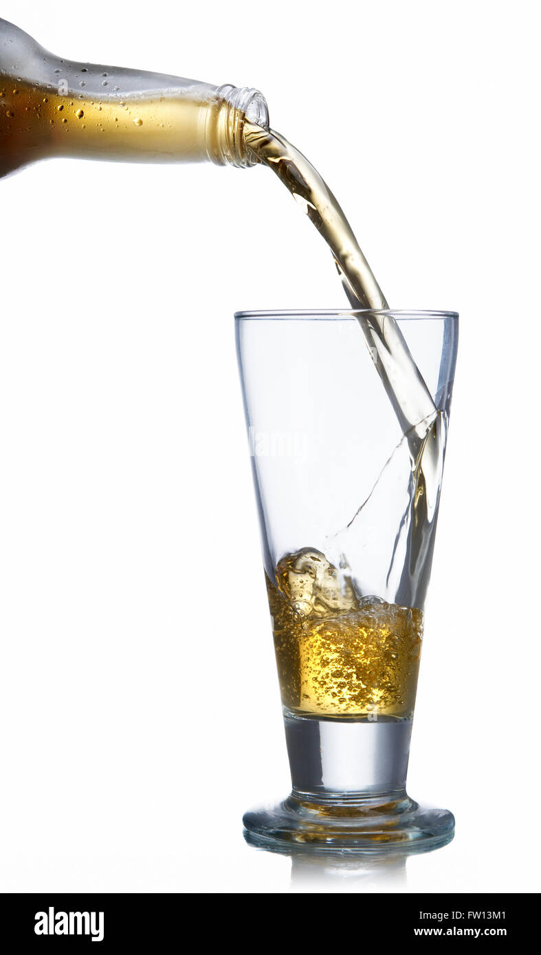 White beer bottle, back lighted showing a glowing golden beer content ...