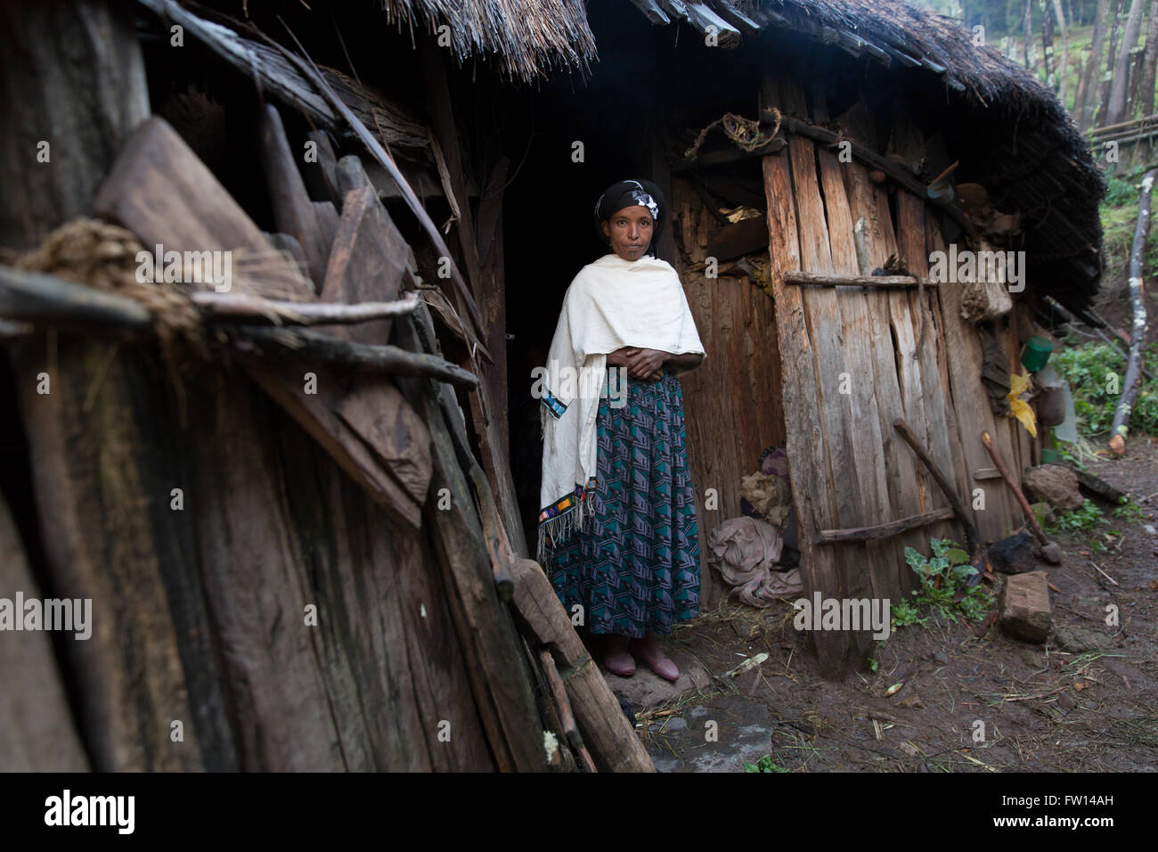 North Shewa, Ethiopia, 2013: Zenobich Ayele, 35. outside her kitchen ...