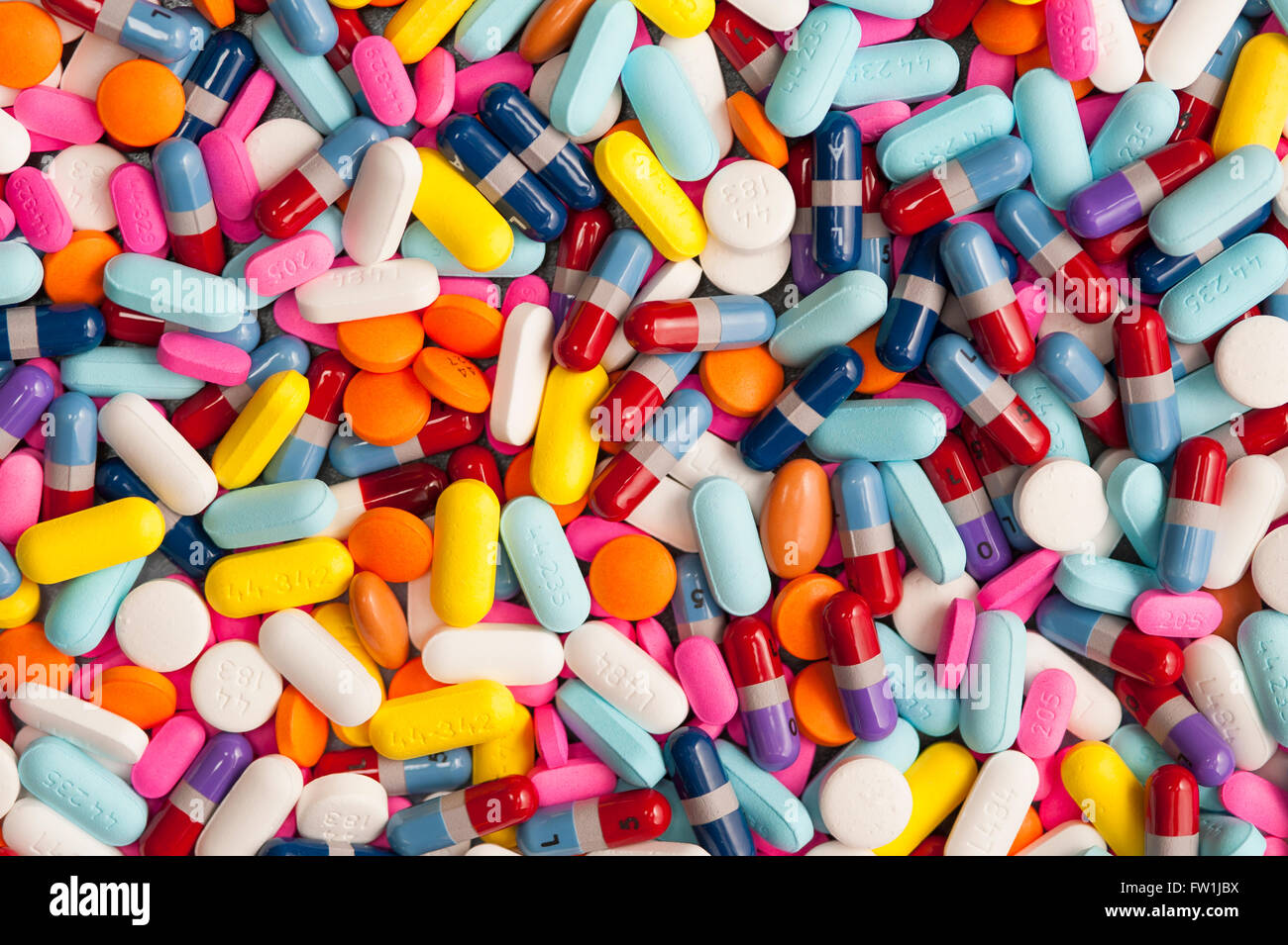 A big pile of multicolored assortment of pills Stock Photo - Alamy