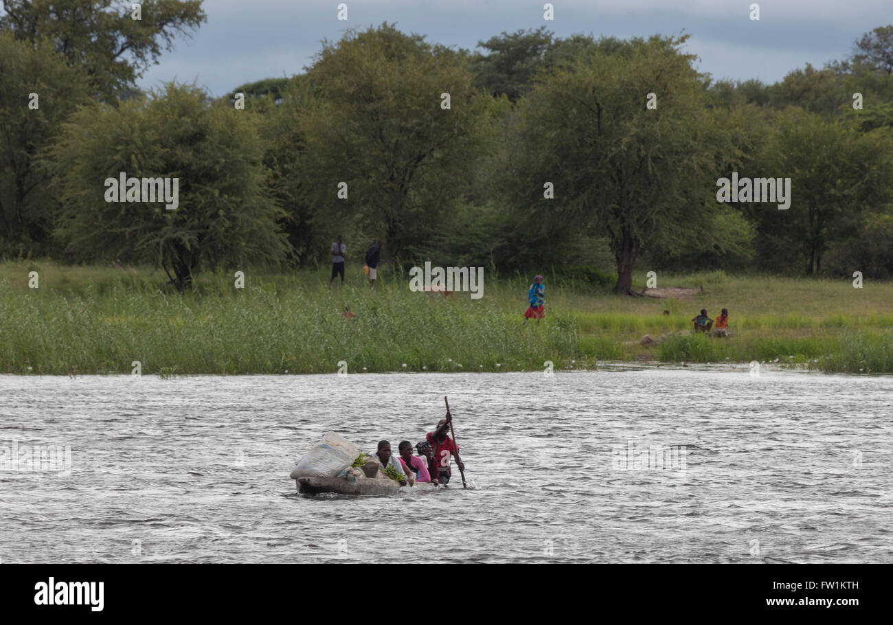 Angolan traders being punted across the Cubango/Okavango river, early ...