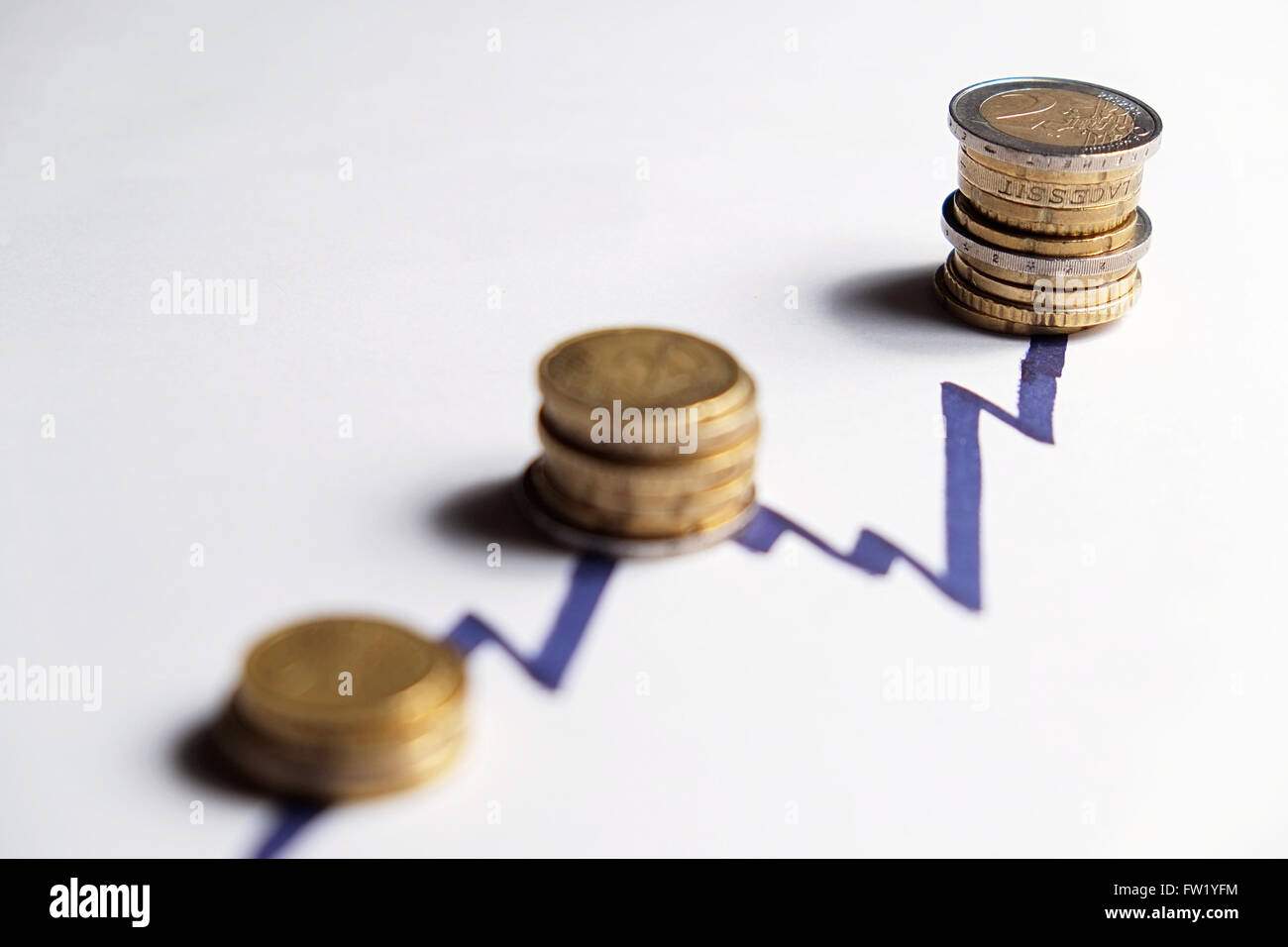Piles of coins with rising chart line. Long-term success Stock Photo ...