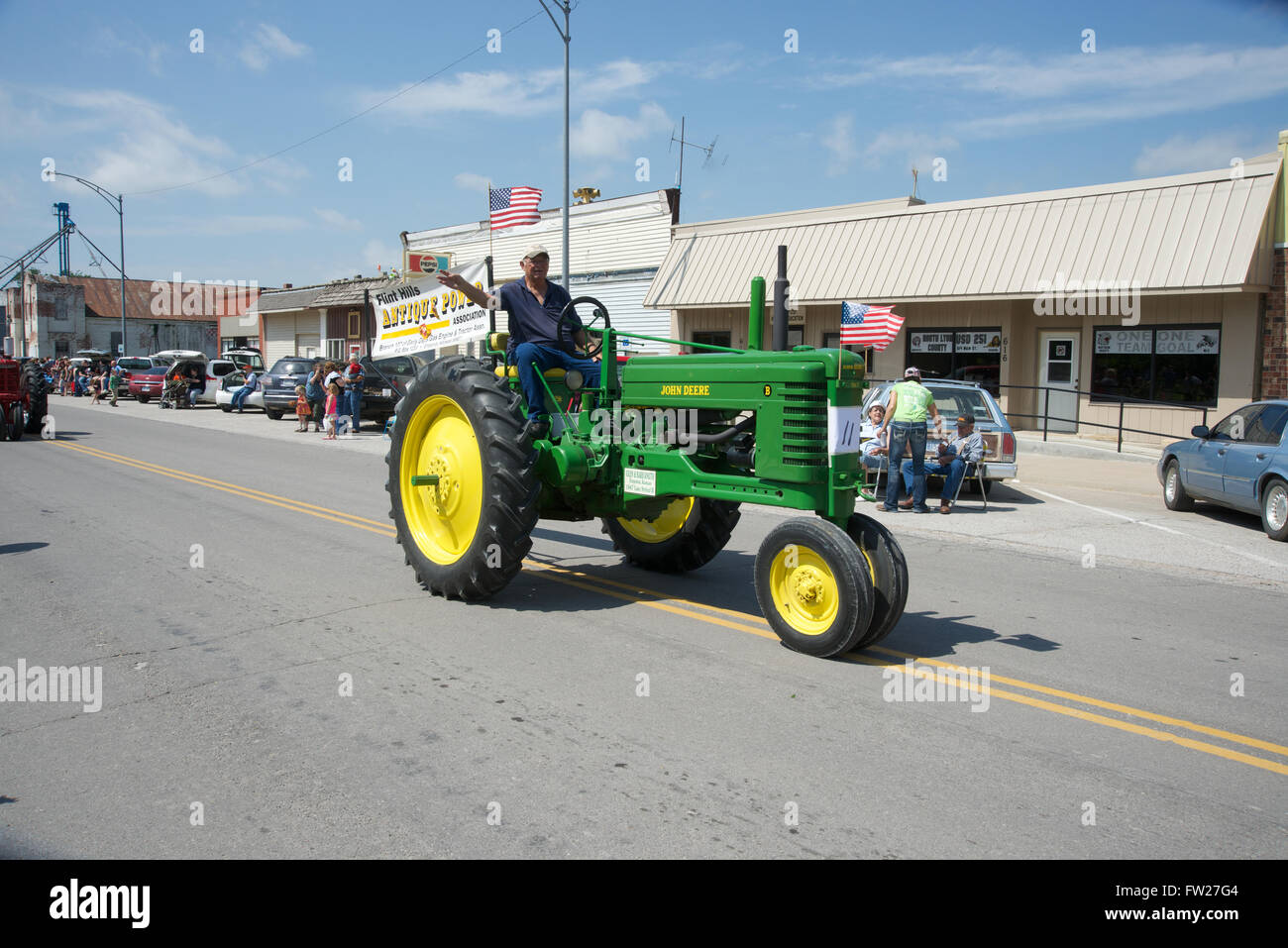 Americus, Kansas, USA, 14th June, 2014 Antique tractors drive in the ...
