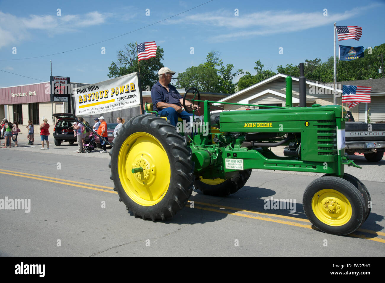 Americus, Kansas, USA, 14th June, 2014 Antique tractors drive in the ...