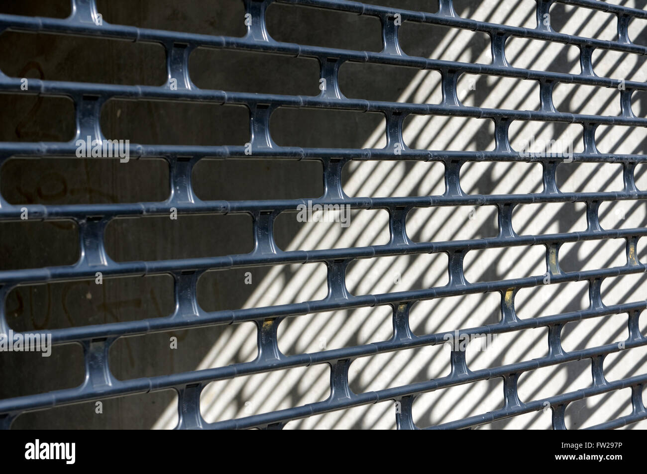 Close up of a metal link lattice rollup garage door Stock Photo - Alamy